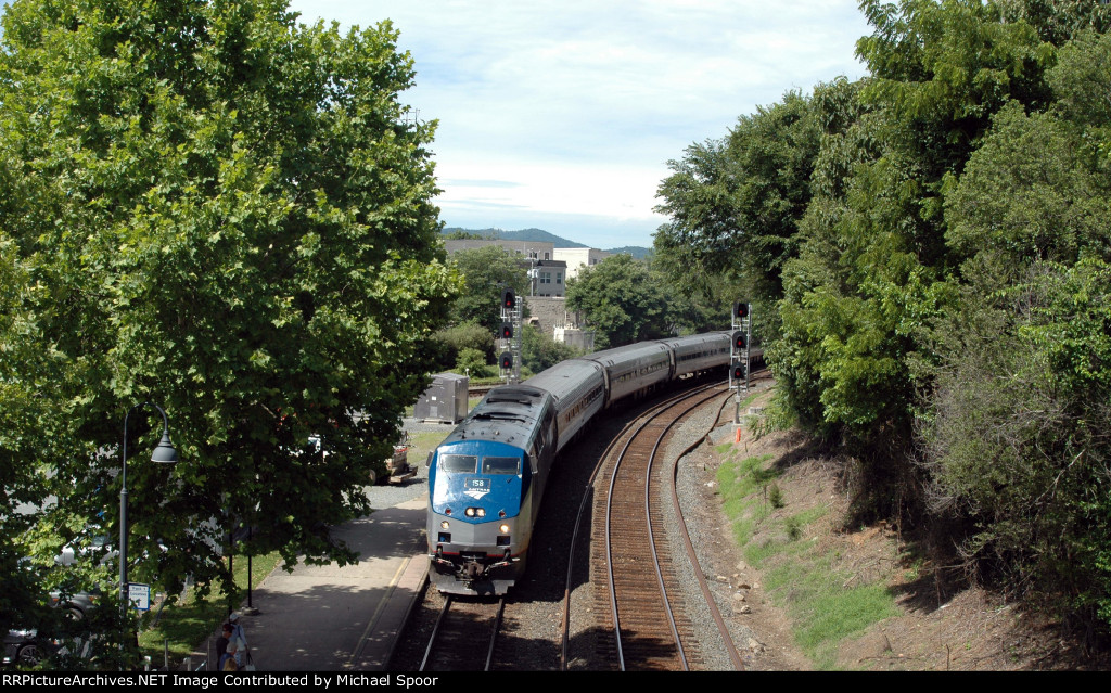 AMTK 158 with dreaded sun glare at Amtrak Station 1 min late